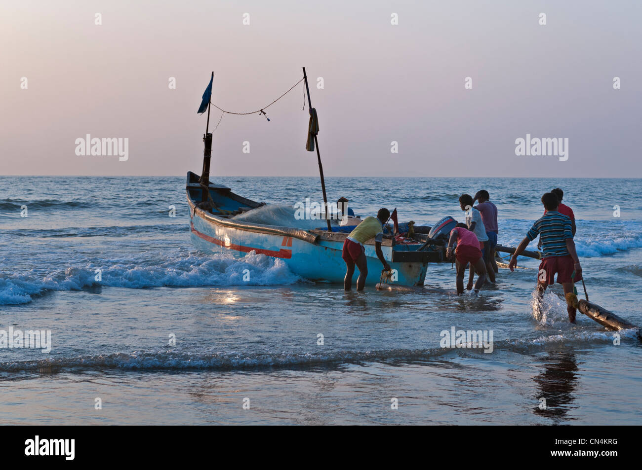 Launching fishing boat Colva Beach Goa India Stock Photo - Alamy