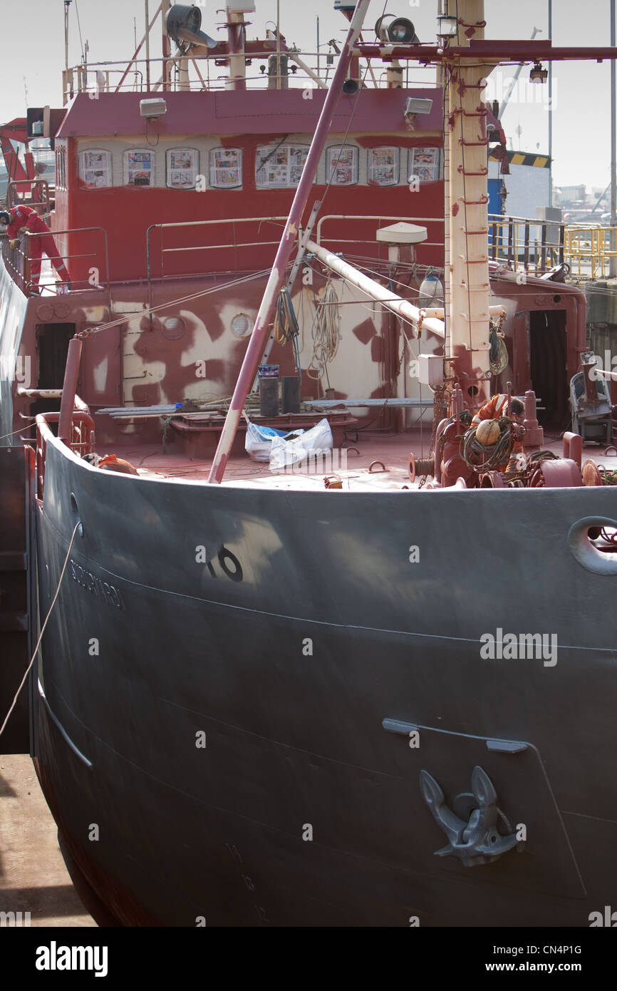 Fishing trawler in shipyard drydock facilities for repairs, maintenance ...