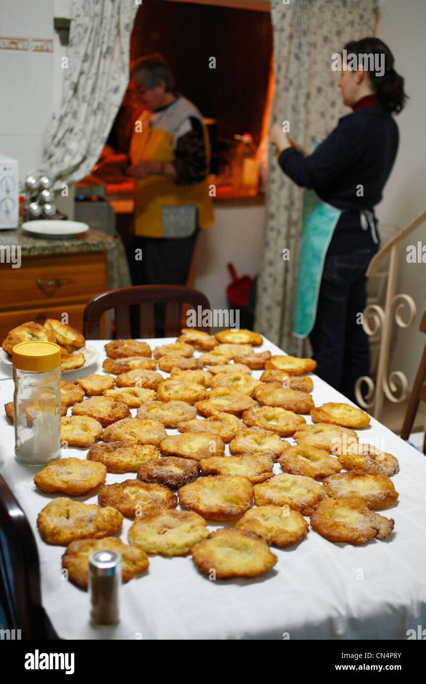 Mother and daughter making Azores islands pastry "malassadas". Sao ...