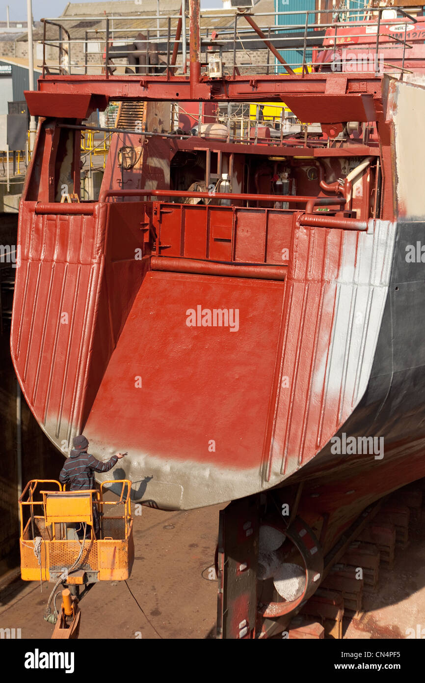 Fishing trawler in shipyard drydock facilities for repairs, maintenance ...