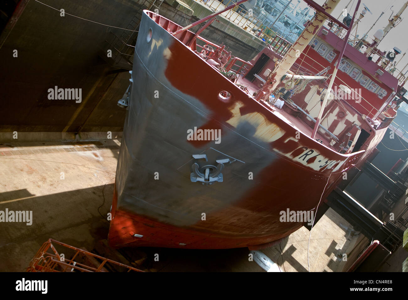 Fishing trawler in shipyard drydock facilities for repairs, maintenance ...