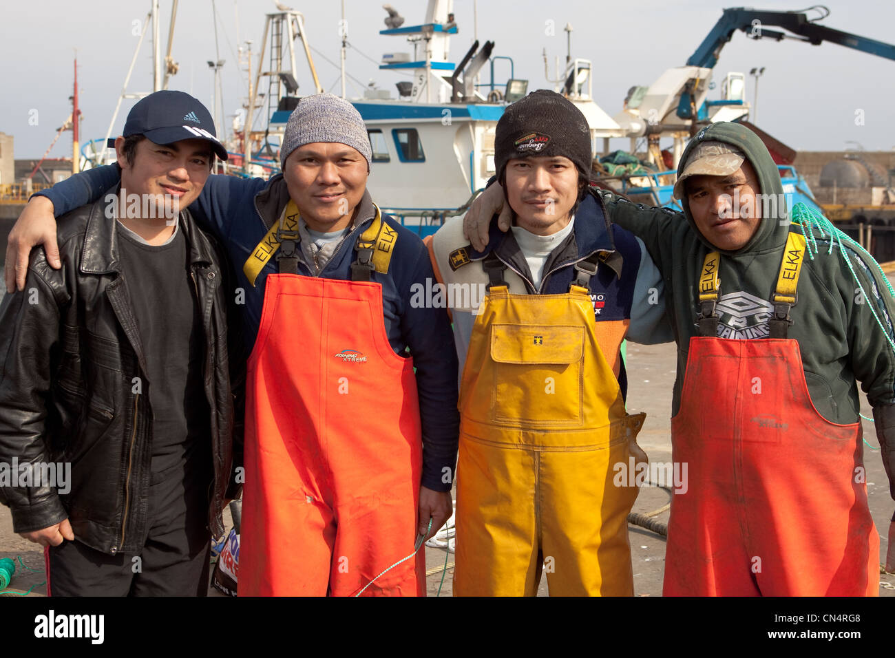 Portrait of a team of Deep sea trawler men Fraserburgh harbour Scotland ...