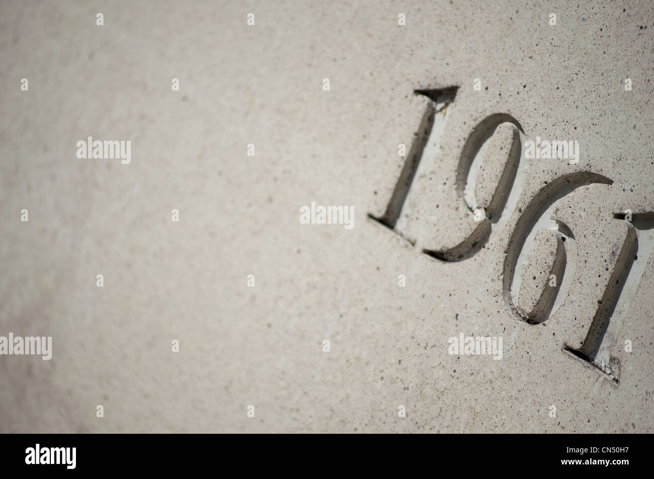 The numbers 1961 engraved on a stone wall Stock Photo - Alamy