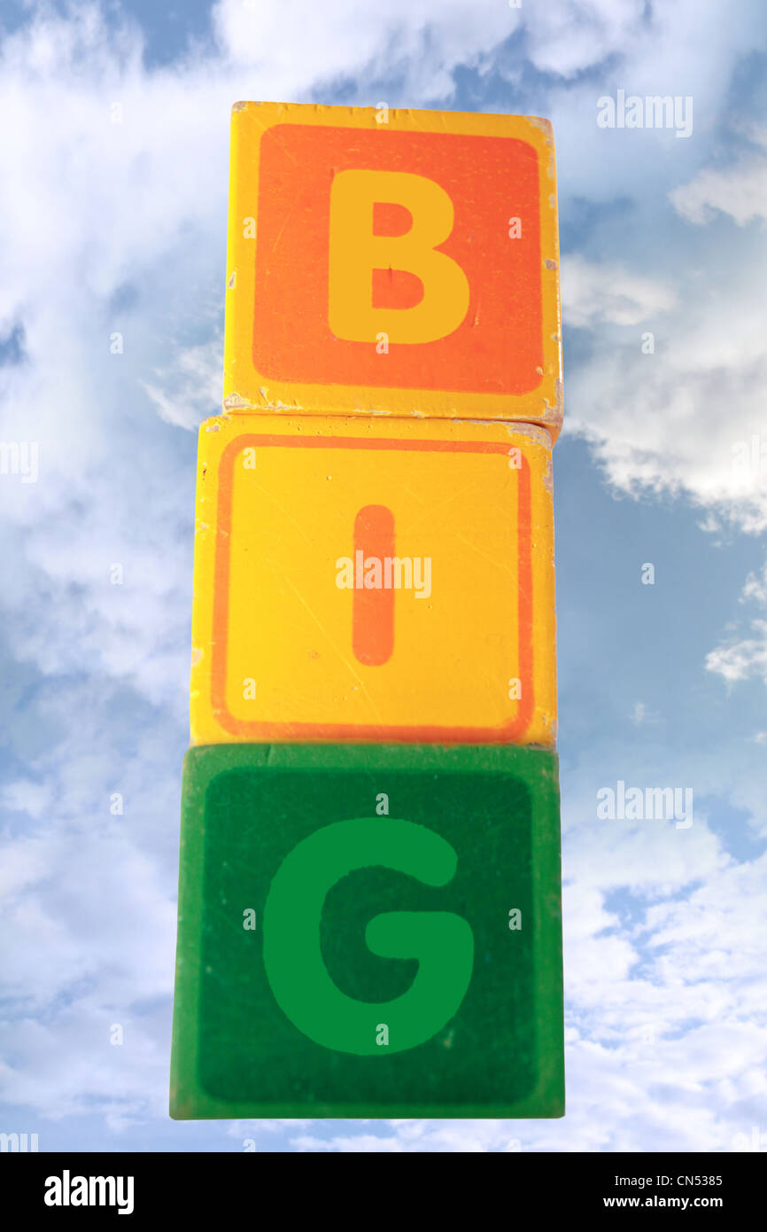 childrens toy letter building blocks against a cloudy background ...