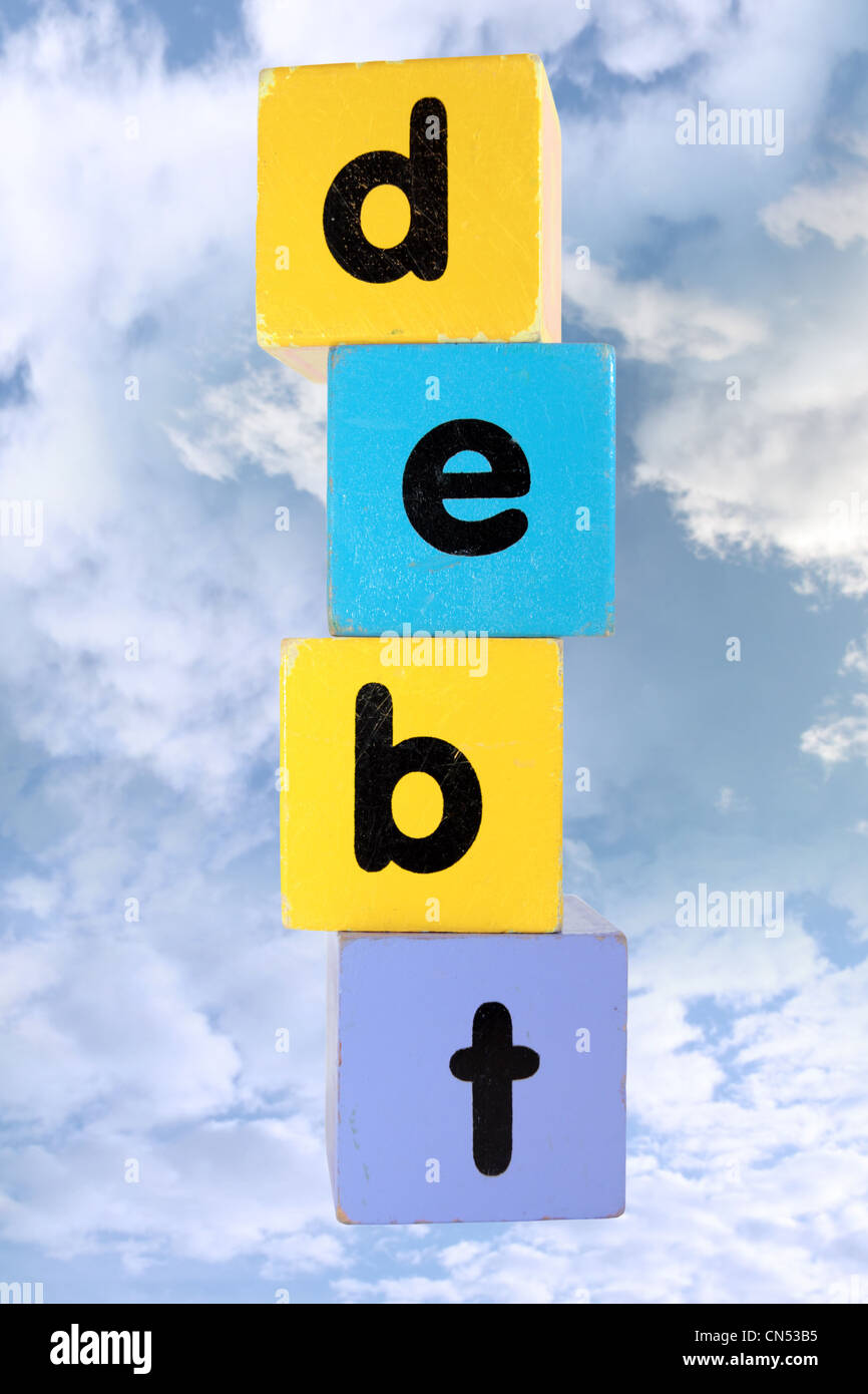 assorted childrens toy letter building blocks against a cloud ...