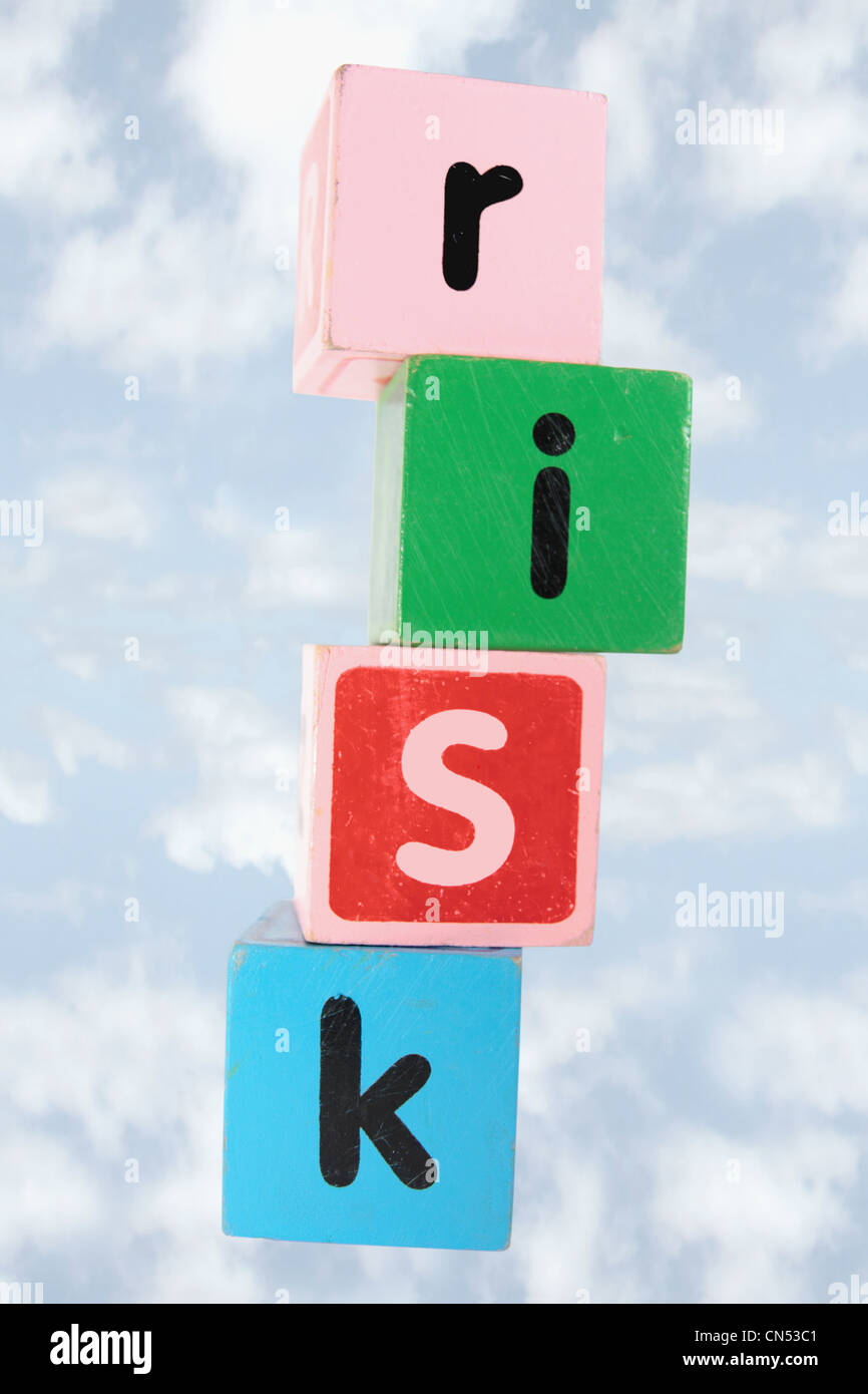 assorted childrens toy letter building blocks against a cloud ...