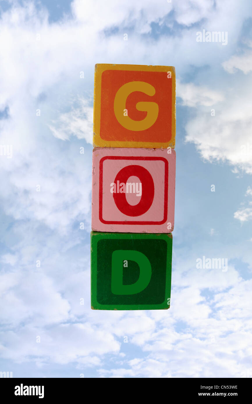 childrens toy letter building blocks against a cloudy background ...