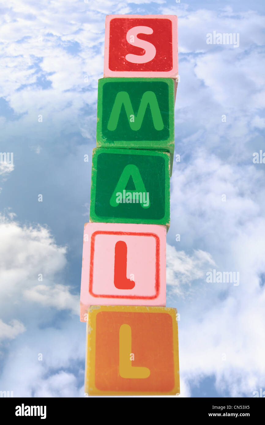 childrens toy letter building blocks against a cloudy background ...