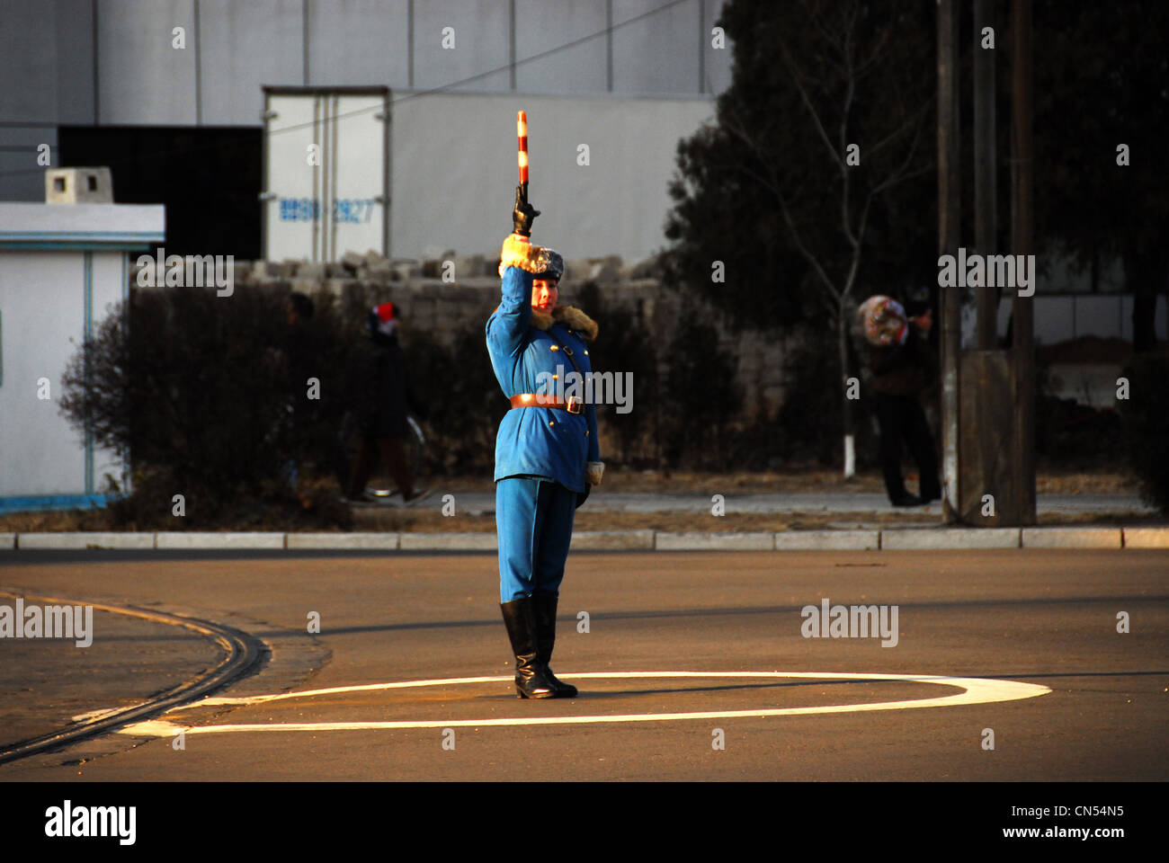 North Korea, Pyongyang, police woman control trafic in a street without ...