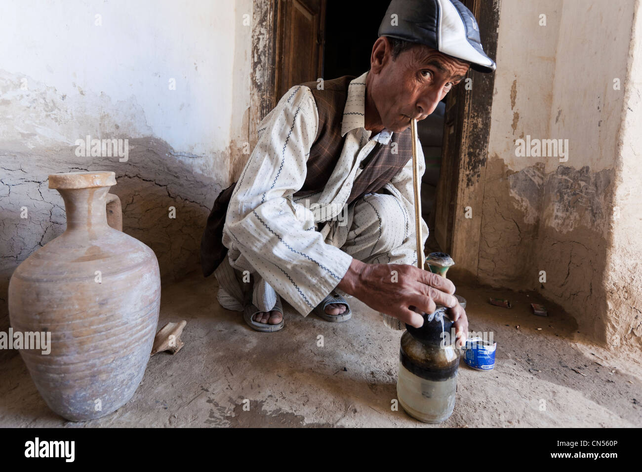 Afghanistan, Faryab province, Andkhoi, market, man smoking hash Stock ...