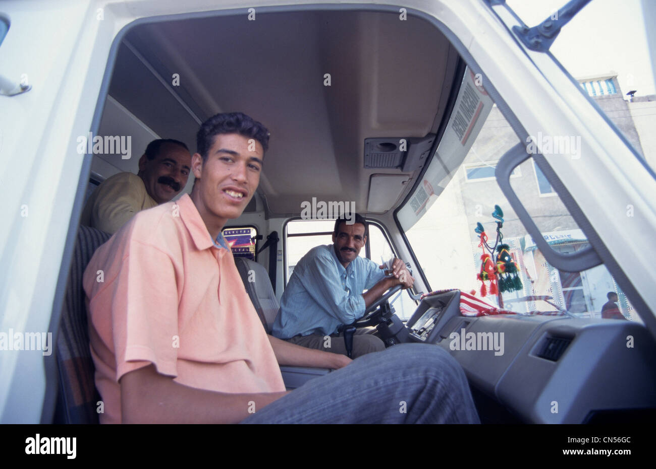 Three Moroccan men in the cab of a truck, Morocco Stock Photo - Alamy