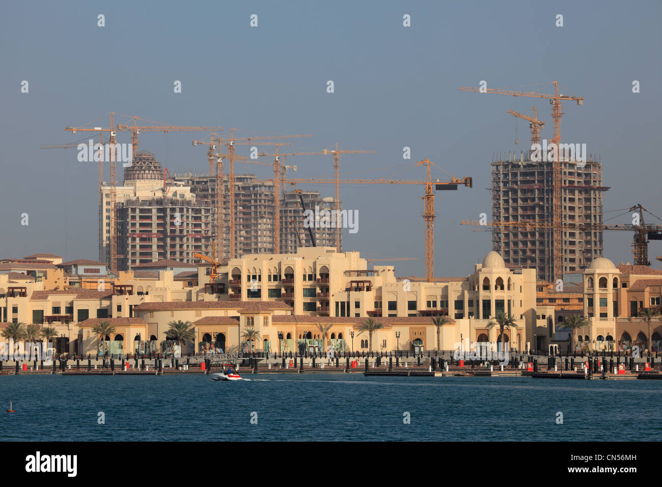 Construction cranes in Porto Arabia. The Pearl, Doha Qatar Stock Photo ...