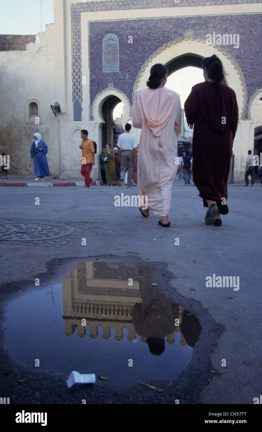 Reflection on the water of two Moroccan girls in one of the main ...