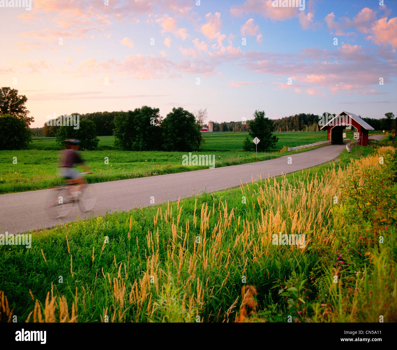 Cyclist and Covered Bridge, St Armand, Quebec Stock Photo - Alamy