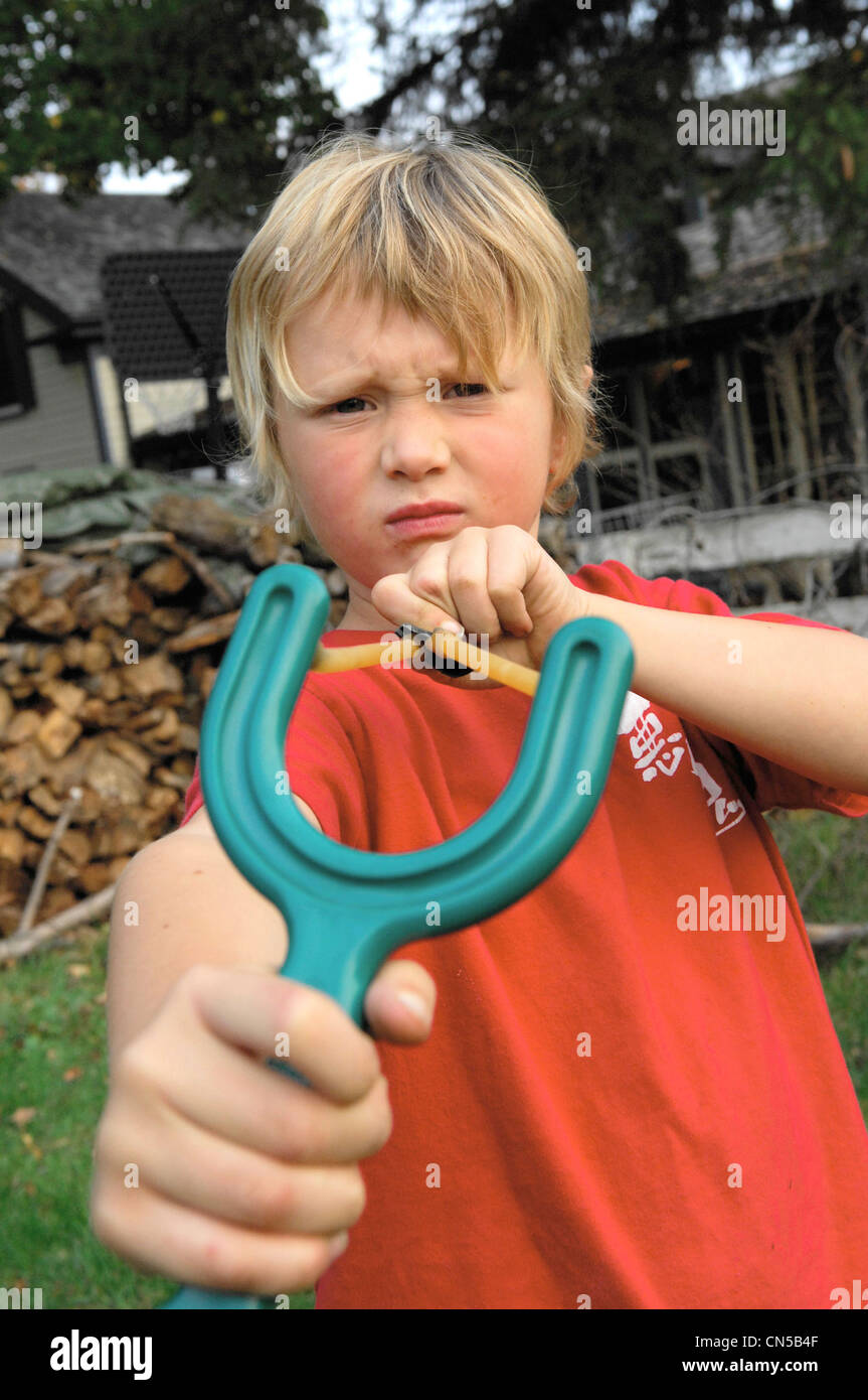 Young Boy Aiming a Slingshot Stock Photo - Alamy