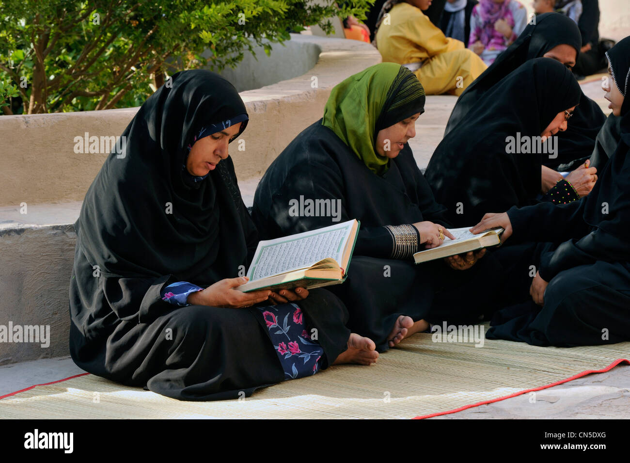 Woman reading quran oman hi-res stock photography and images - Alamy