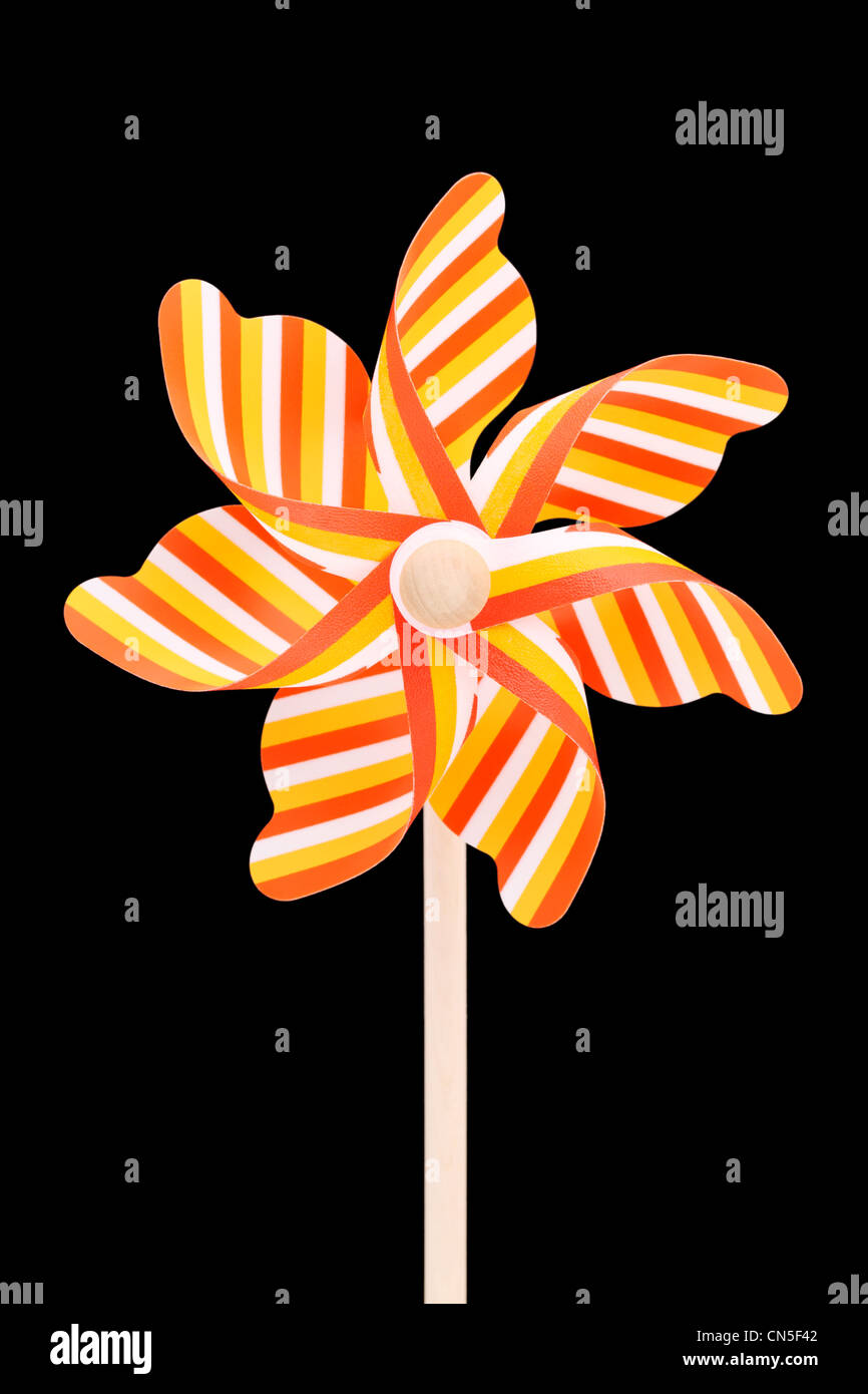 Colorful toy pinwheel on black background Stock Photo - Alamy
