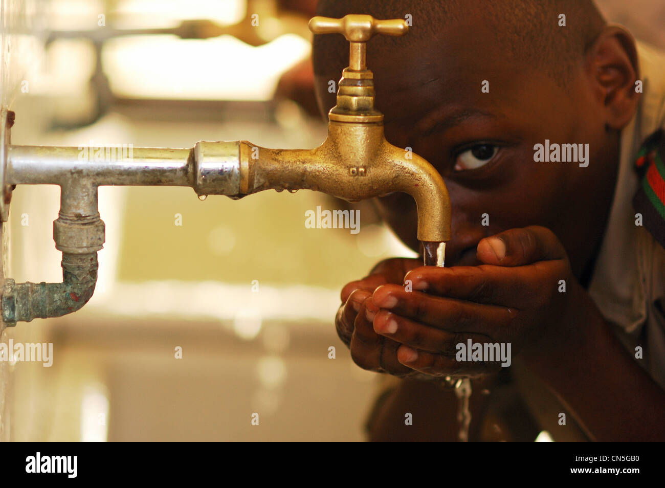 Barbados Island, Farmers, close-up portrait of a thirsty schoolboy ...