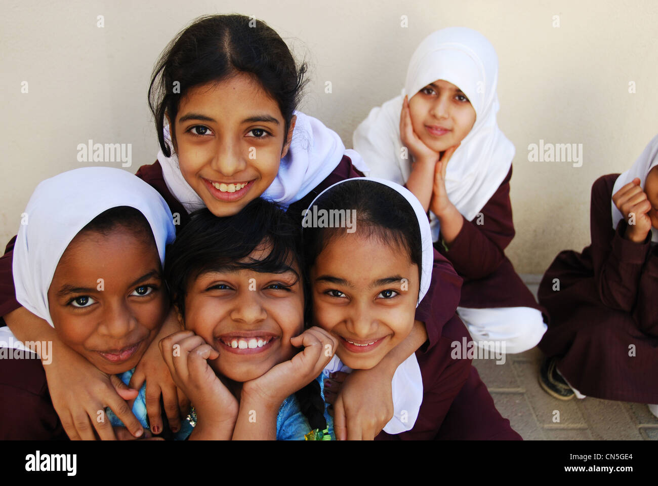 Sultanate of Oman, Muscat, close-up of happy school girls Stock Photo ...