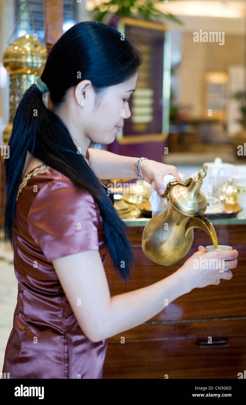 Bahrain, Manama city, Seef quarter, a maid in the Ritz Carlton Hotel ...