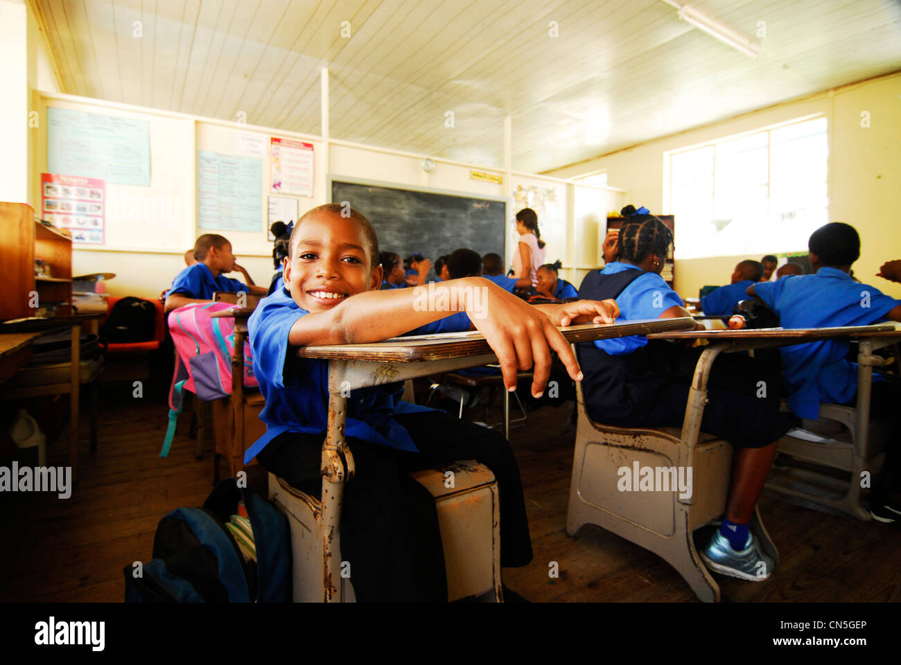 West Indies Caribbean, Saint Lucia, Canaries, schoolboy sitting in a ...
