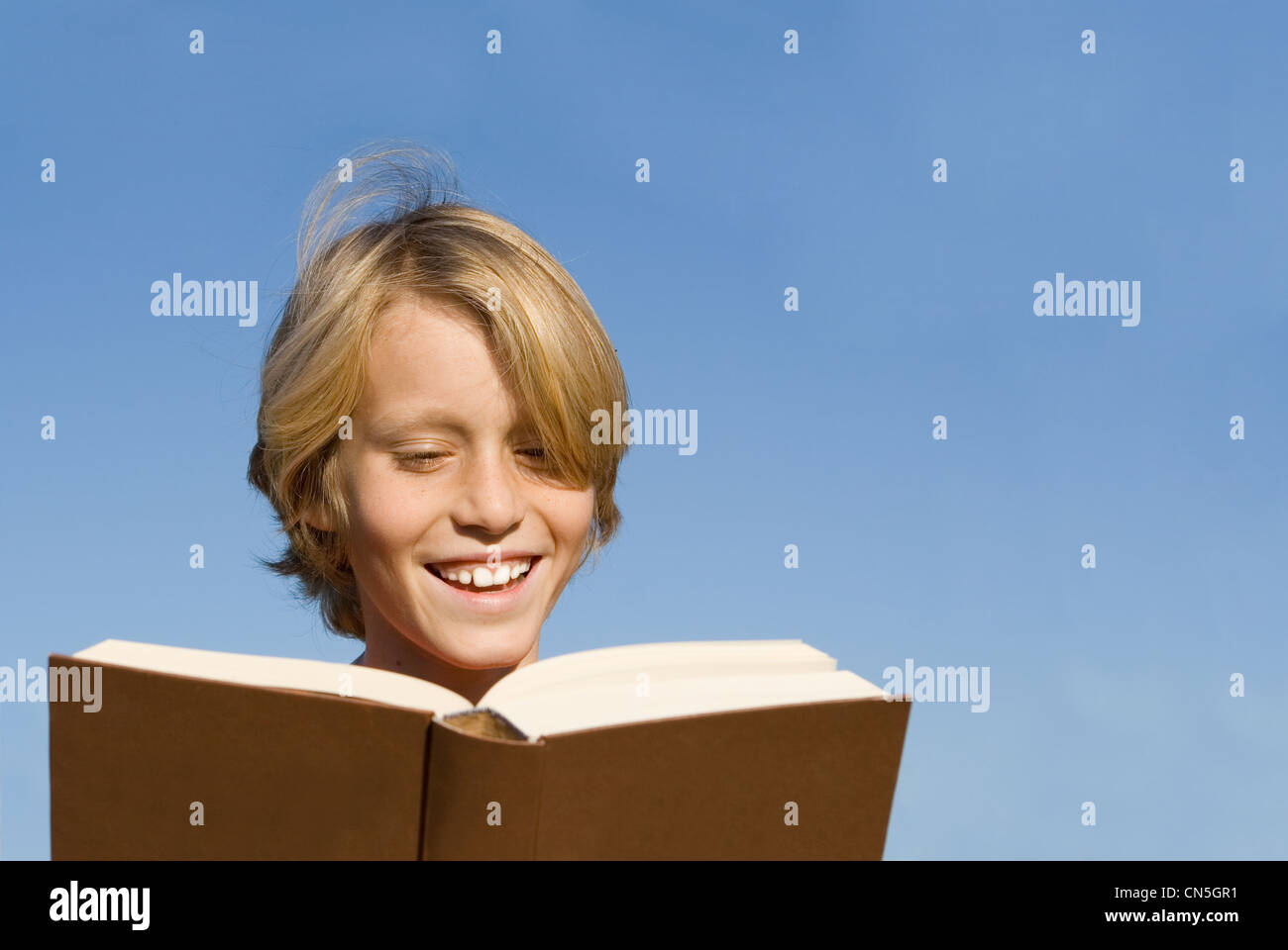 happy child or kid reading book or bible Stock Photo - Alamy