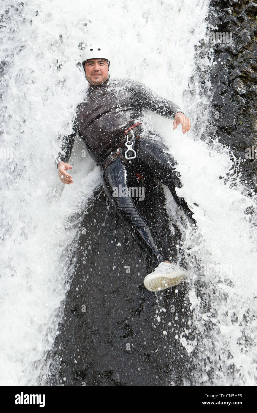 Adult Man Descending Into A Waterfall Shoot From The Water Level Stock ...