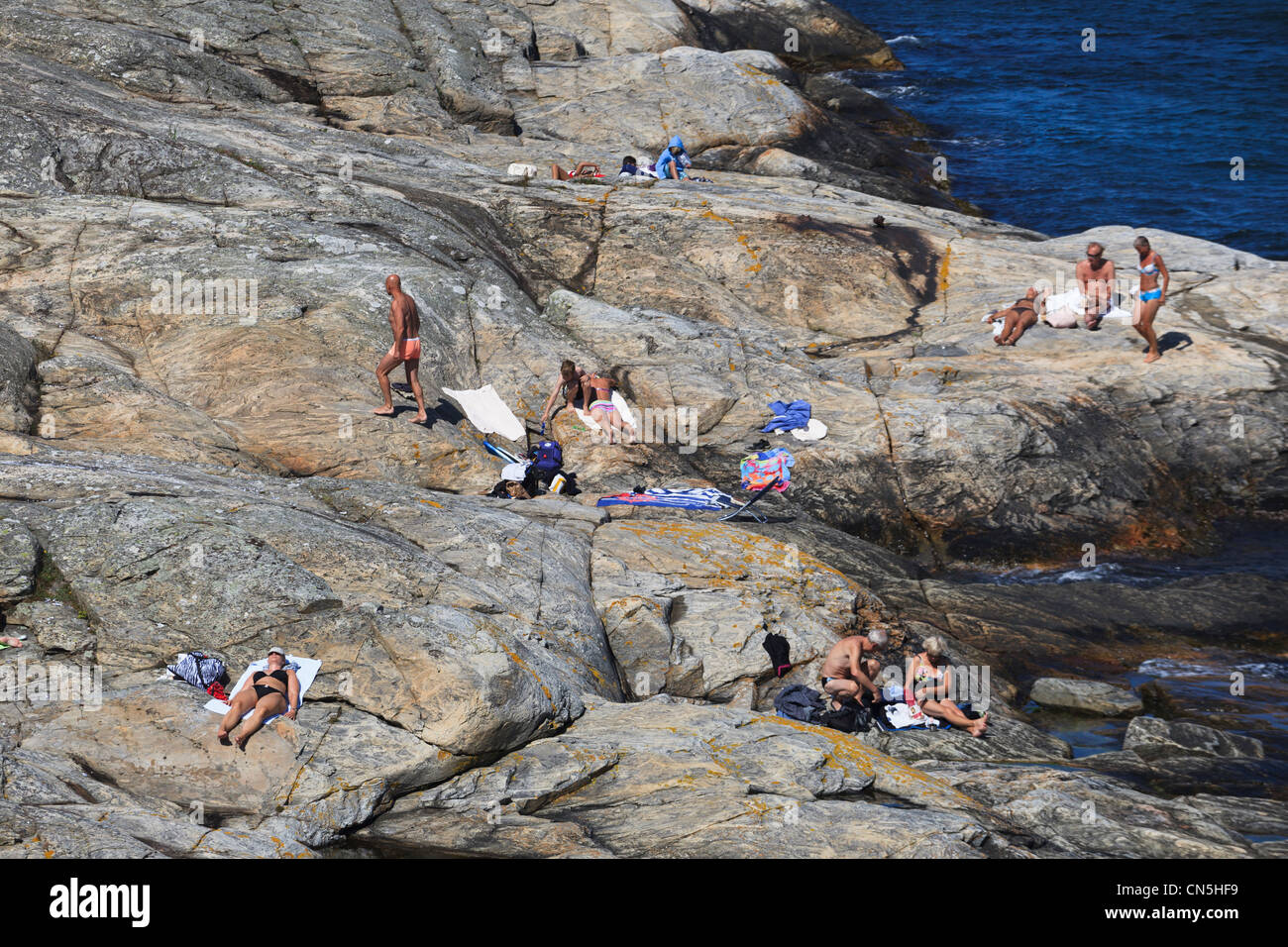 Women sunbathing lying on cliff hi-res stock photography and images - Alamy
