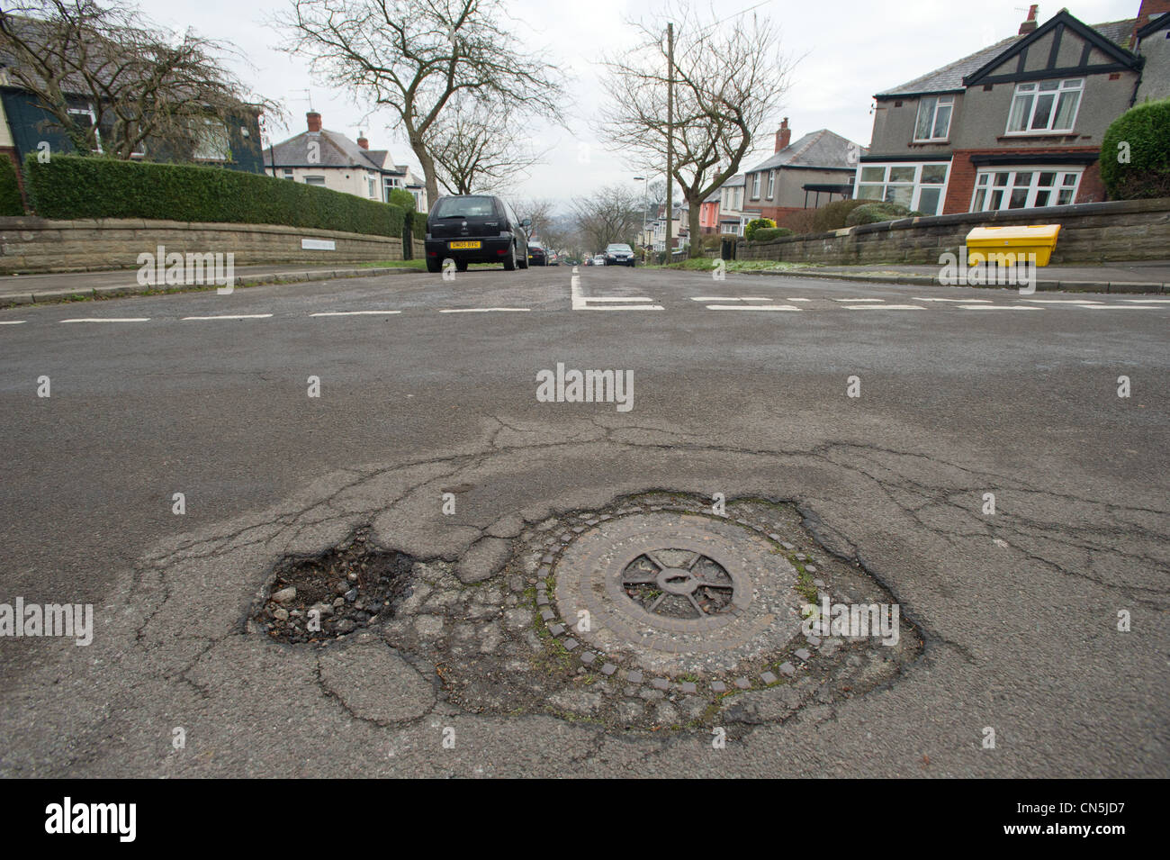 Potholes in the road Stock Photo - Alamy