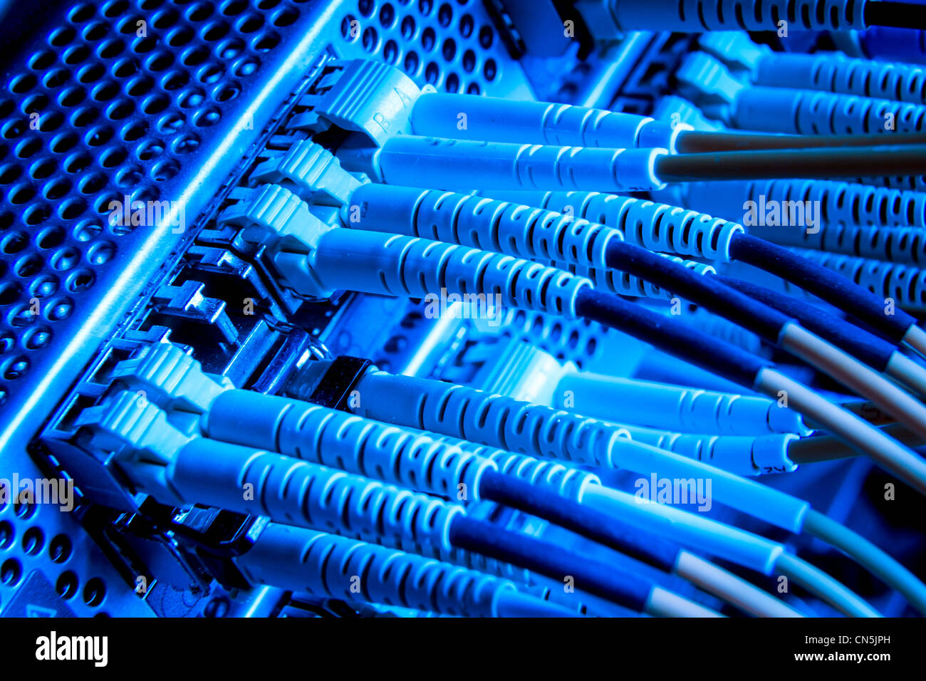 optic fiber cables connected to hub Stock Photo - Alamy
