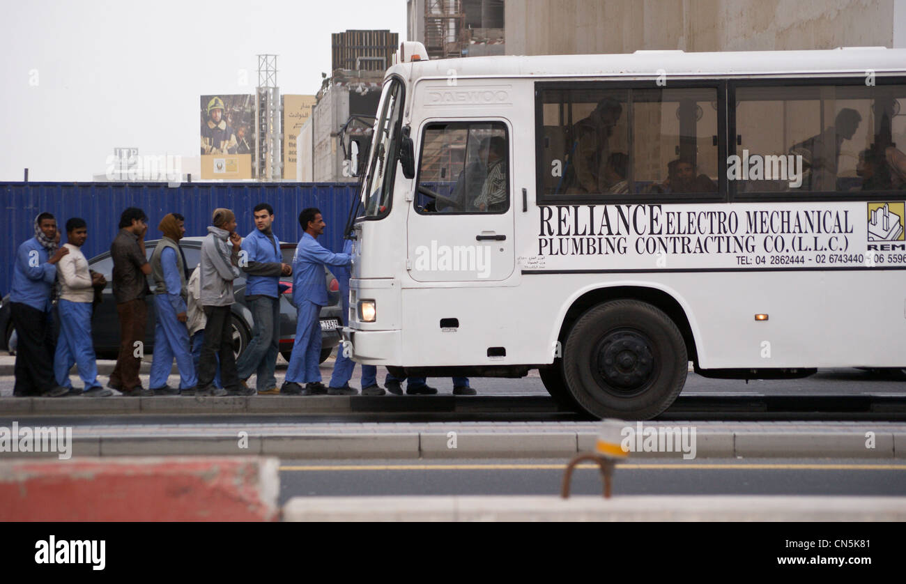 Indian migrant workers boarding a bus, Dubai Marina, Dubai, United Arab ...