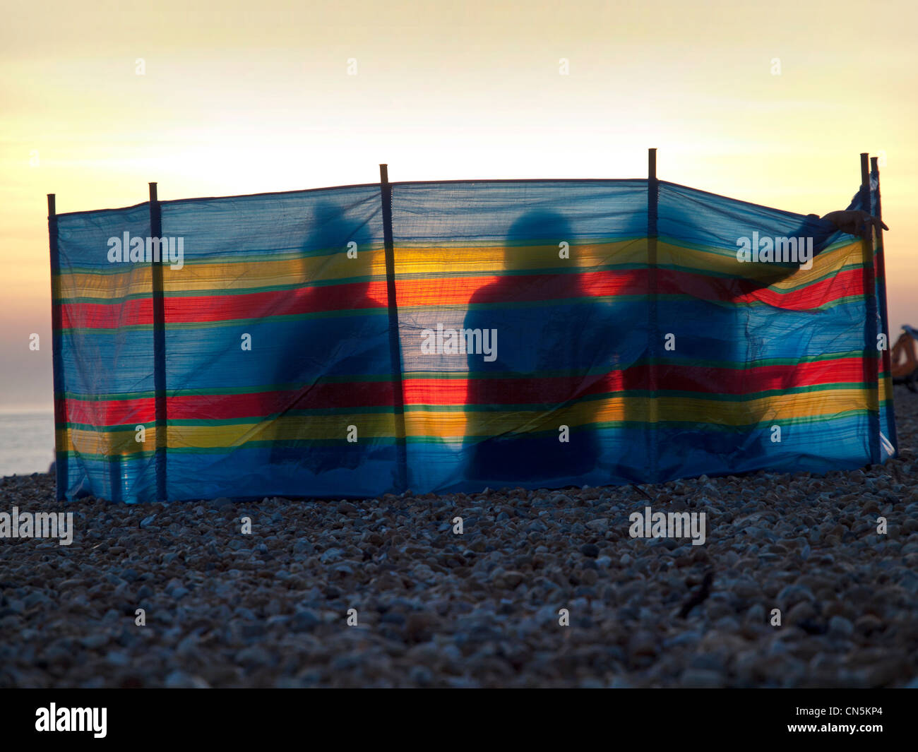 A wind-breaker at sunset Stock Photo - Alamy
