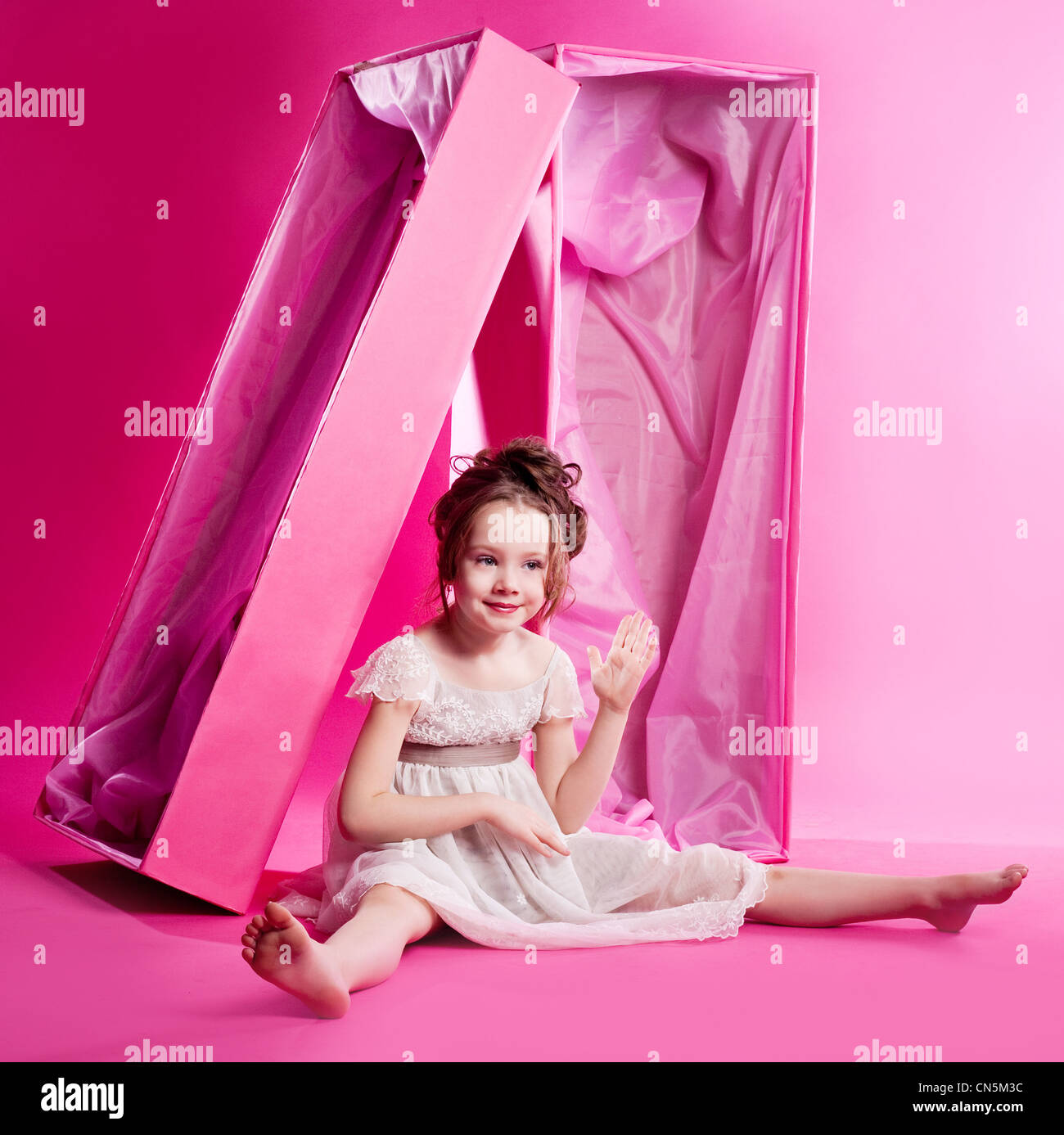 girl in the box, alive doll, studio Stock Photo - Alamy