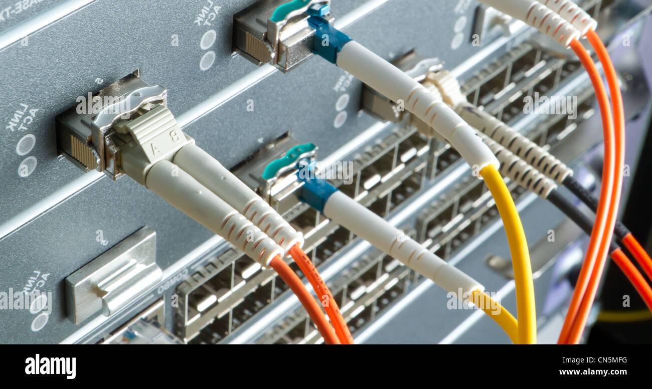 optic fiber cables connected to data center Stock Photo - Alamy