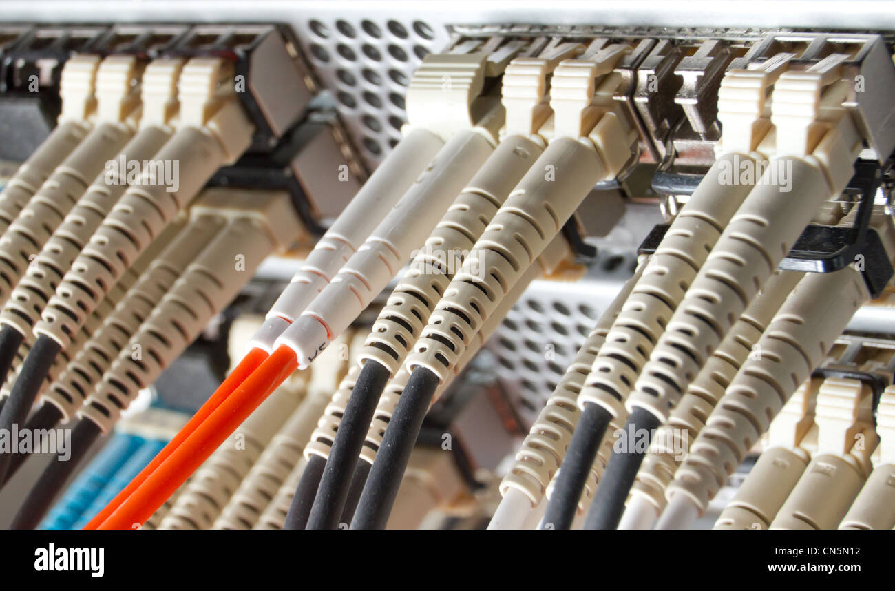 optic fiber cables connected to hub Stock Photo - Alamy