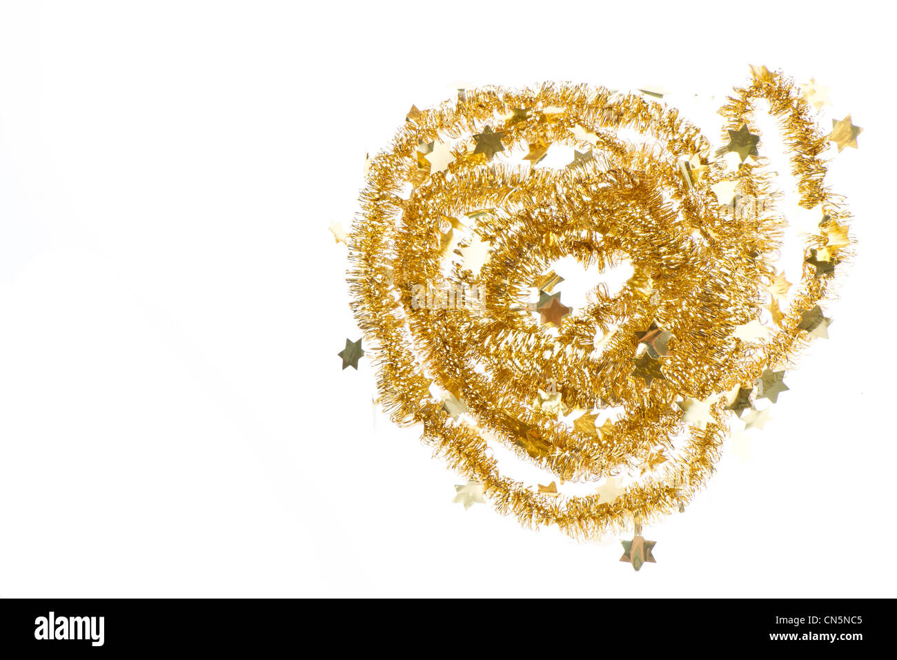 golden tinsel with small stars isolated on white background Stock Photo ...