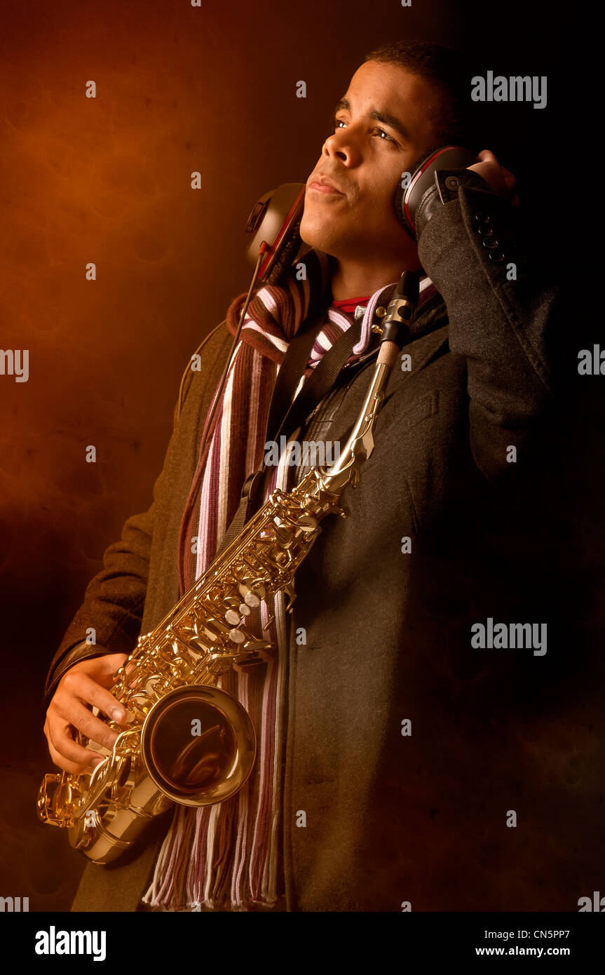 Stylish man playing the saxophone Stock Photo - Alamy