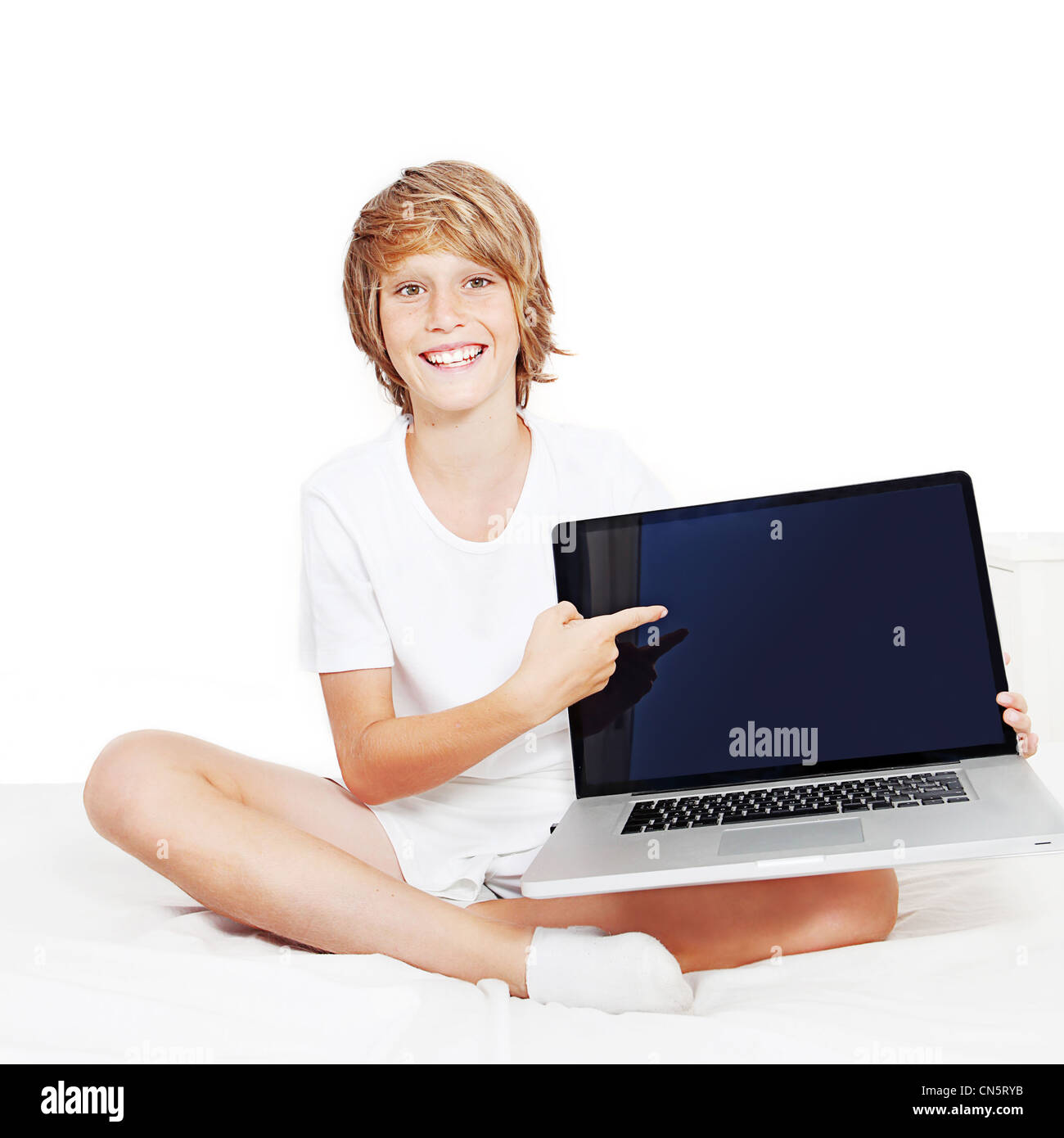kid with laptop computer pointing at screen Stock Photo - Alamy