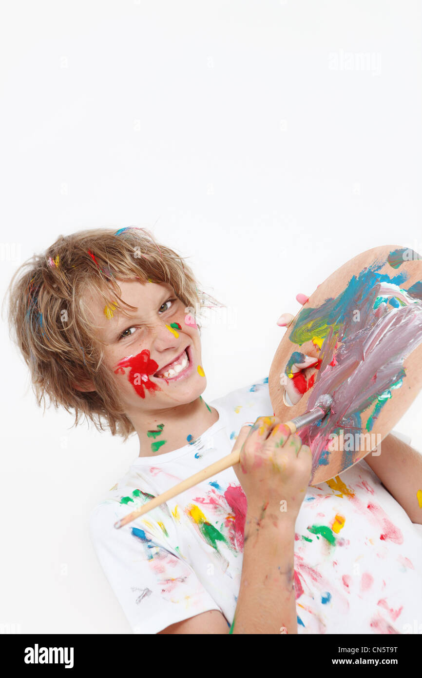 cheeky kid playing with paint Stock Photo - Alamy