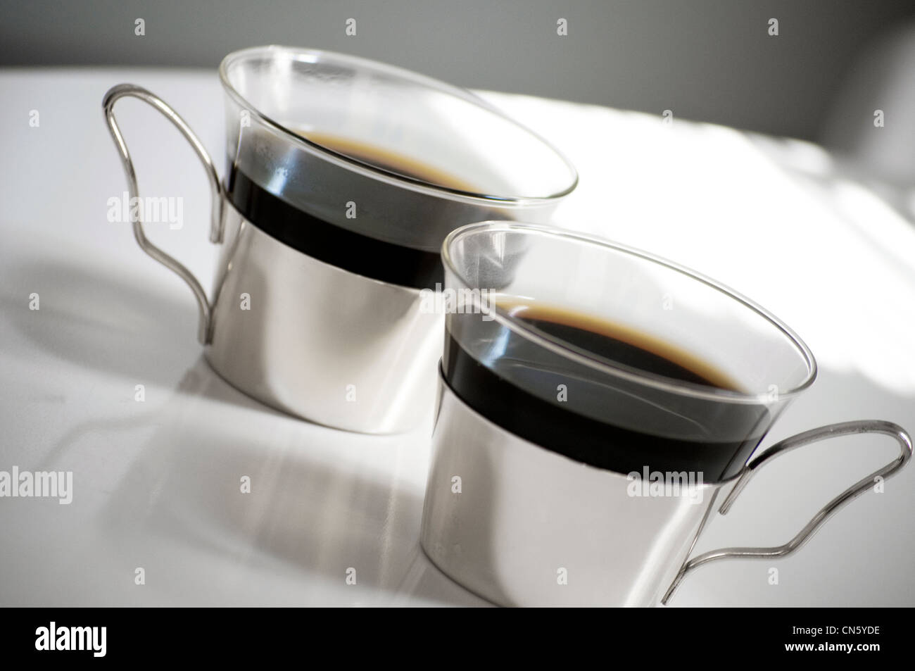 Two silver coffee cups Stock Photo - Alamy