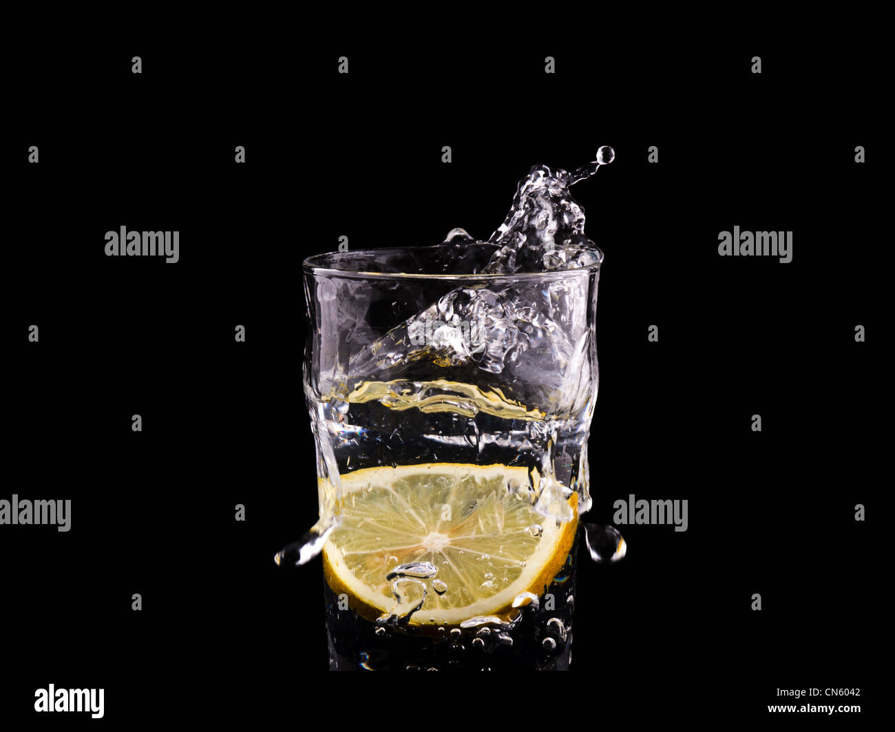 Lemon slice drop in water Stock Photo - Alamy