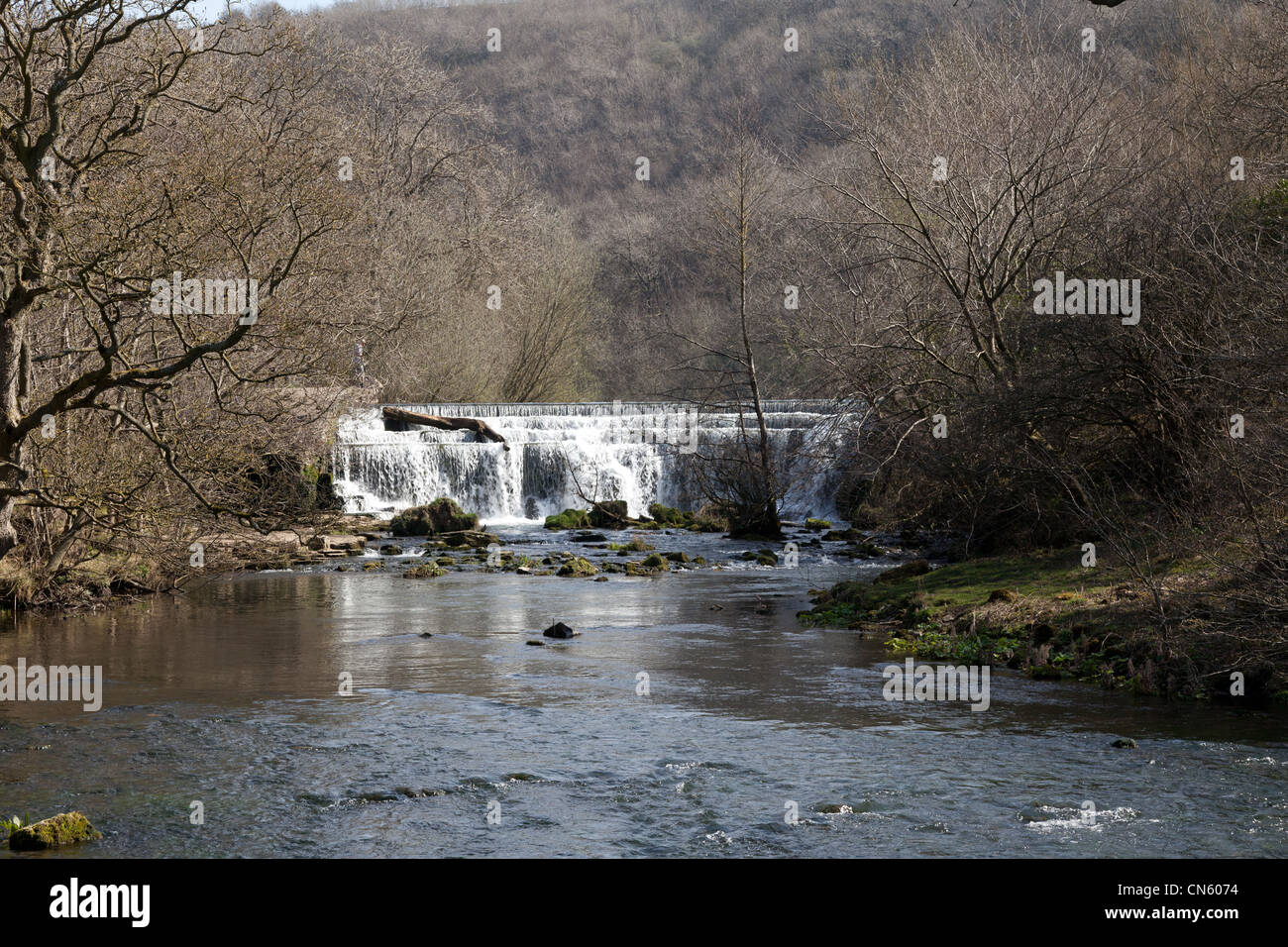A weir in the river Wye in Monsal Dale in the Peak District, Derbyshire ...
