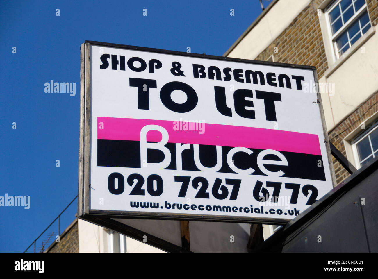 Shop and basement to let sign Stock Photo - Alamy