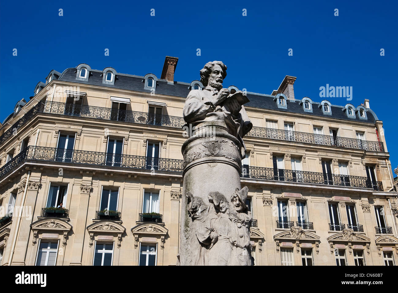 France, Paris, bust of drawer Paul Gavarni and façade of a building ...