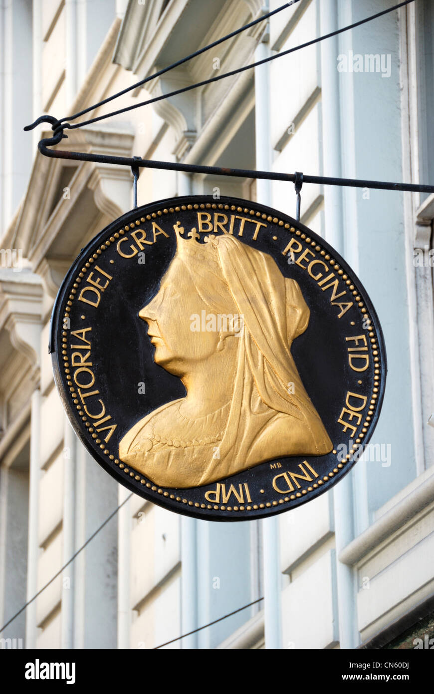 Queen Victoria one penny replica sign outside an a coin collectors shop ...