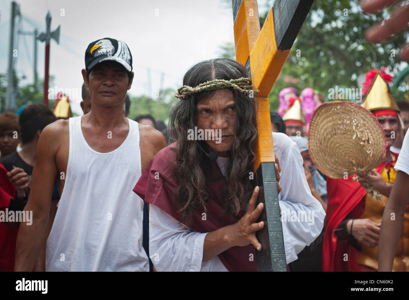 Main character carries the cross to the Cutud crucifixion site during ...