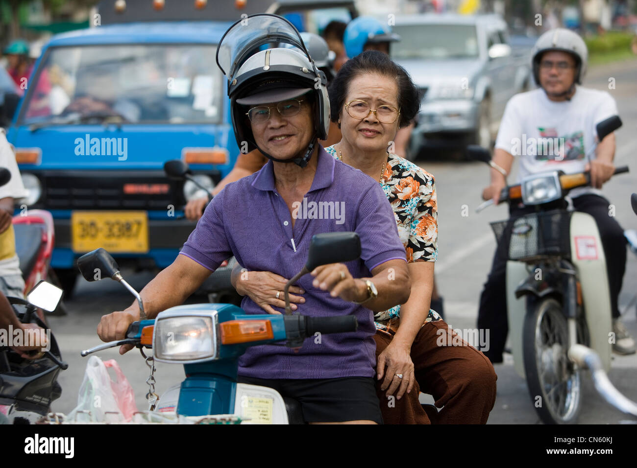 Asian family on a motorbike hi-res stock photography and images - Alamy