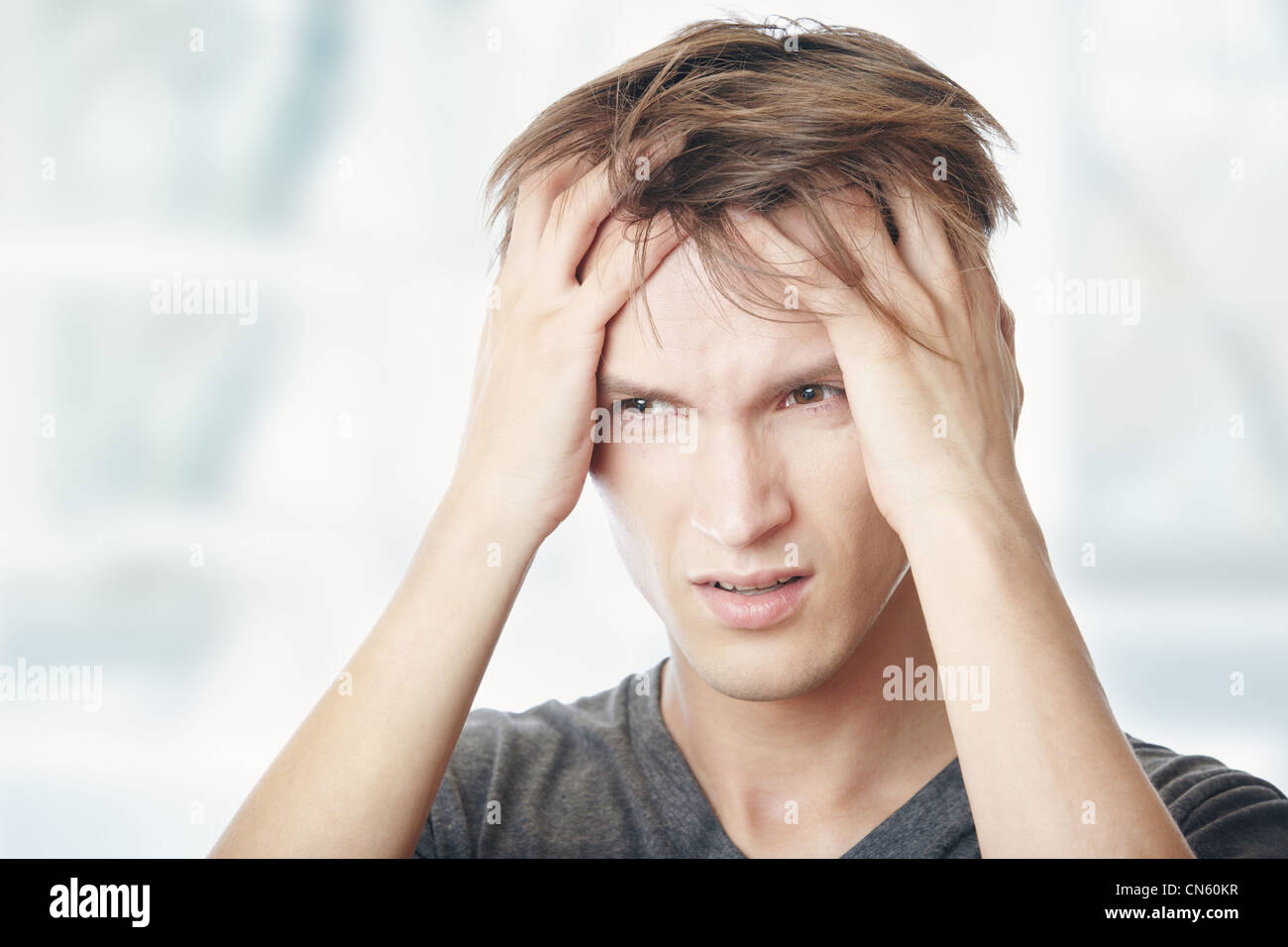 Human at home suffering from headaches Stock Photo - Alamy