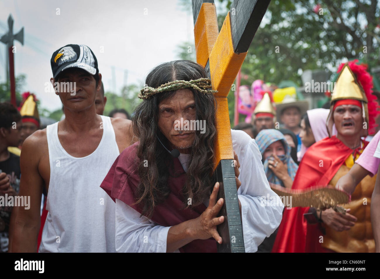 Main character carries the cross to the Cutud crucifixion site during ...