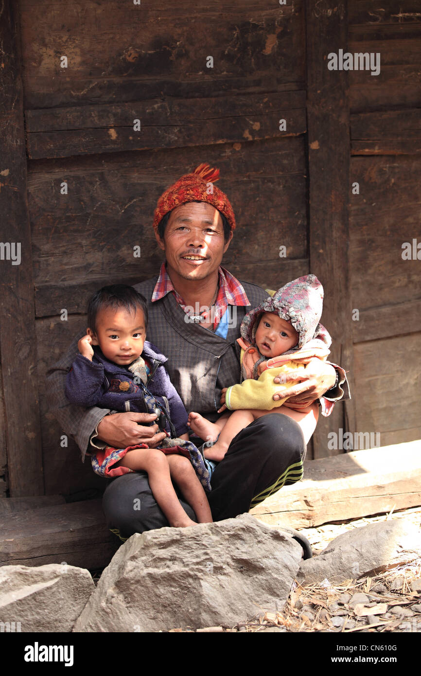 Nepali rural man with children Nepal Stock Photo - Alamy
